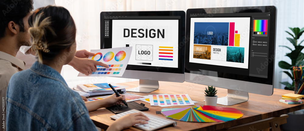 ภาพถ่าย Stock Graphic designer work on computer laptop and with graphic ...