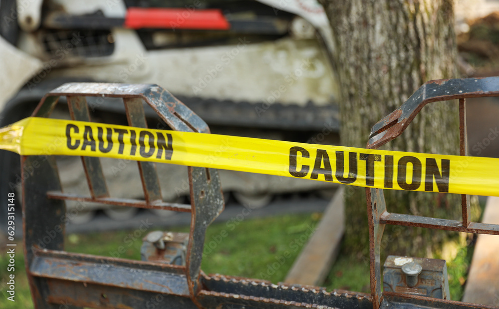 yellow caution tape signals danger and restriction. Its bright color ...