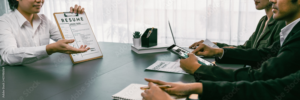 Candidate and interviewers discuss work experience and qualifications ...