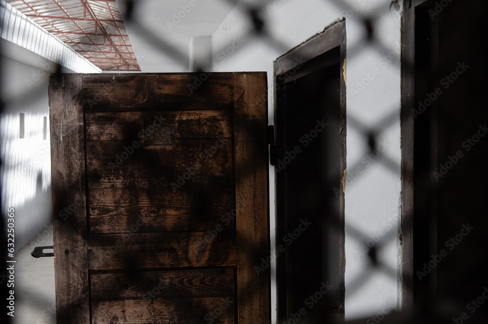 View through a grid on a solitary confinement cell at the Small ...