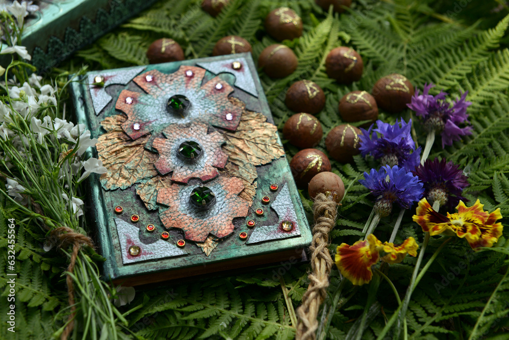 Still life with beautiful magic book of spells or diary and runes ...