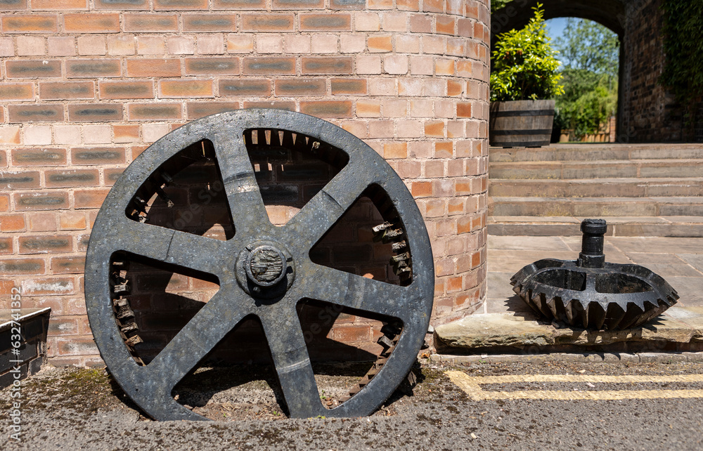 Huge, rusting abandoned flywheel from a Victorian era lifting engine ...