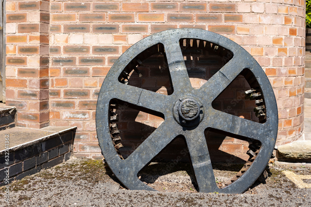 Huge, rusting abandoned flywheel from a Victorian era lifting engine ...