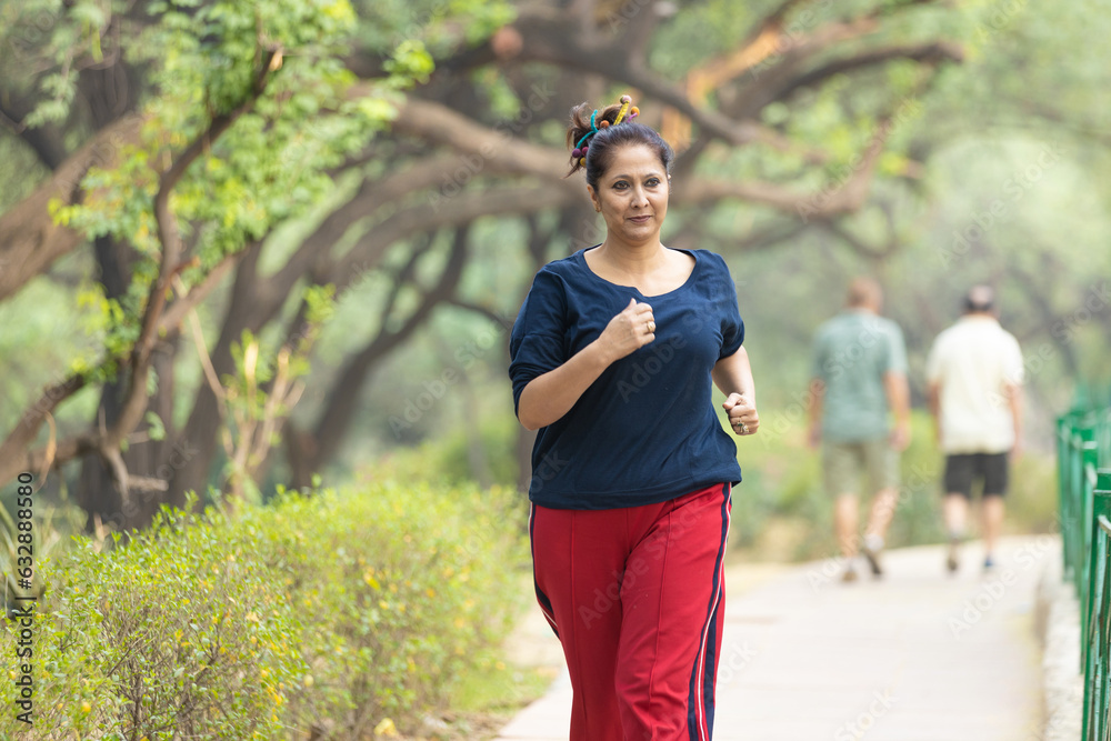 Indian woman doing jogging at park. Stock Photo | Adobe Stock