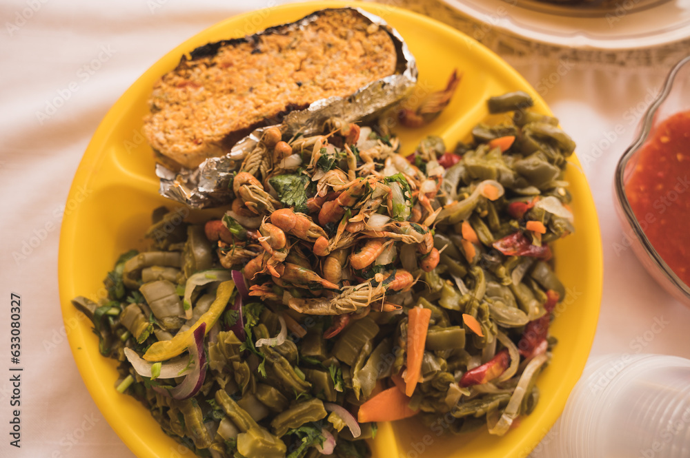 Fish roe cooked with chicken roe, onion and tomato, with cooked ...