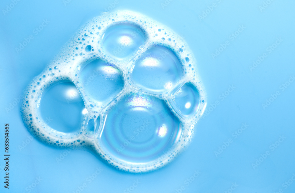 Foam soap bubbles on blue background. Liquid soap bubble, Froth ...