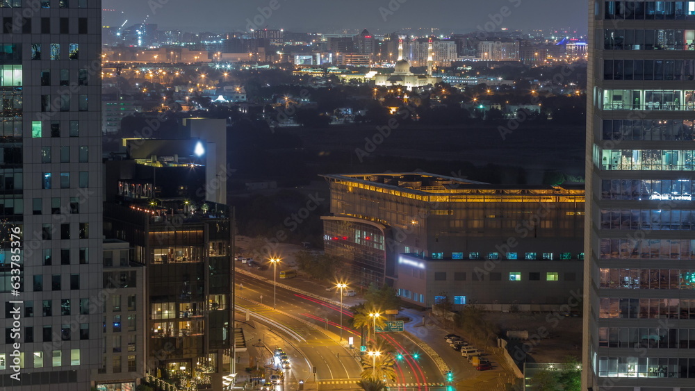 Skyline view of traffic on Al Saada street near DIFC district all night ...