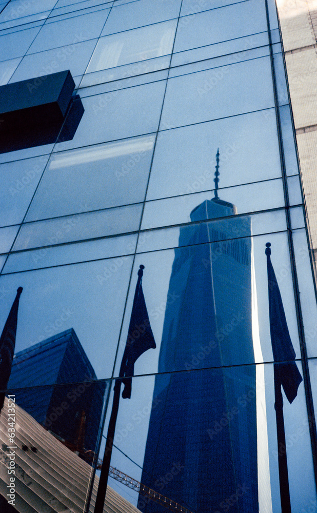 reflection of Freedom Tower in glass facade downtown New York City ...