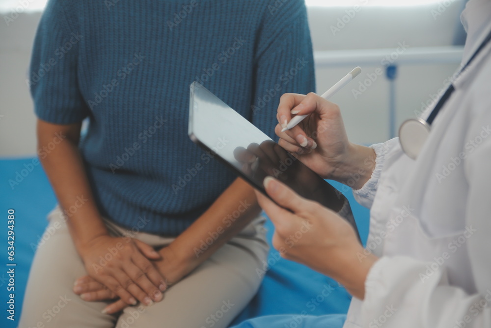 Young doctor is using a stethoscope listen to the heartbeat of the ...