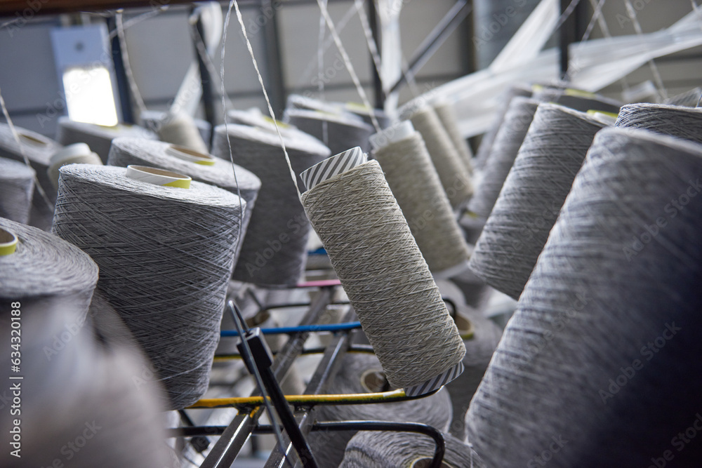 Stock-Foto „Raw spindles of industrial cotton in a weaving factory ...