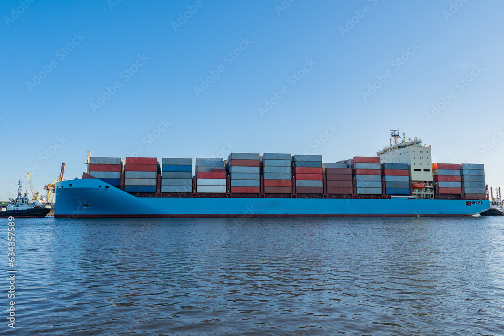 Ship with containers at sea. Ship is sailing on ocean. Container ship ...