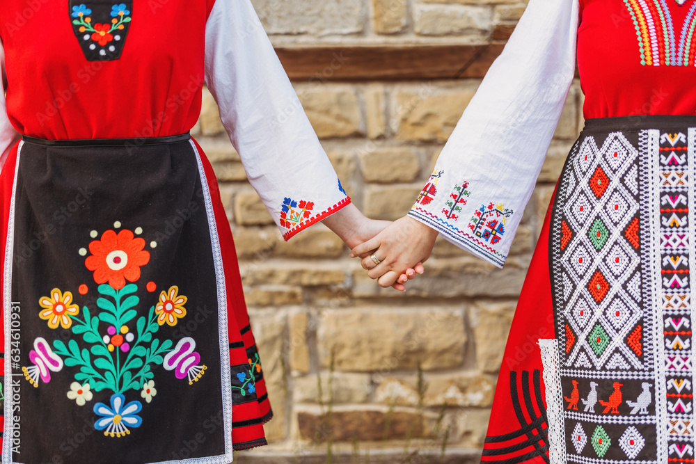 Girls in traditional bulgarian ethnic costumes with folklore embroidery ...