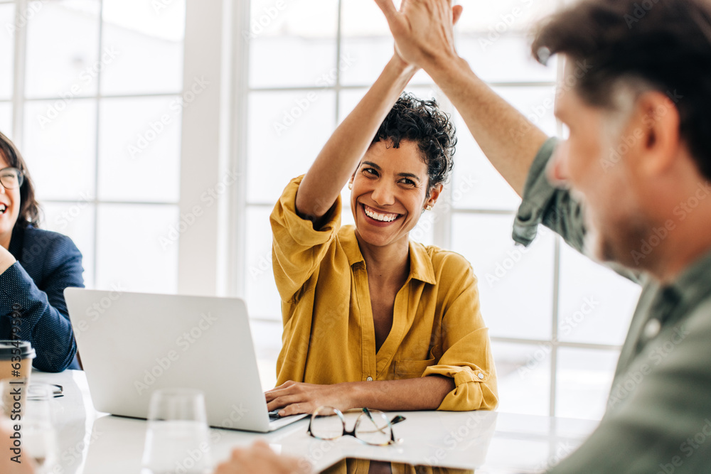 Business people celebrating success in an office Stock Photo | Adobe Stock