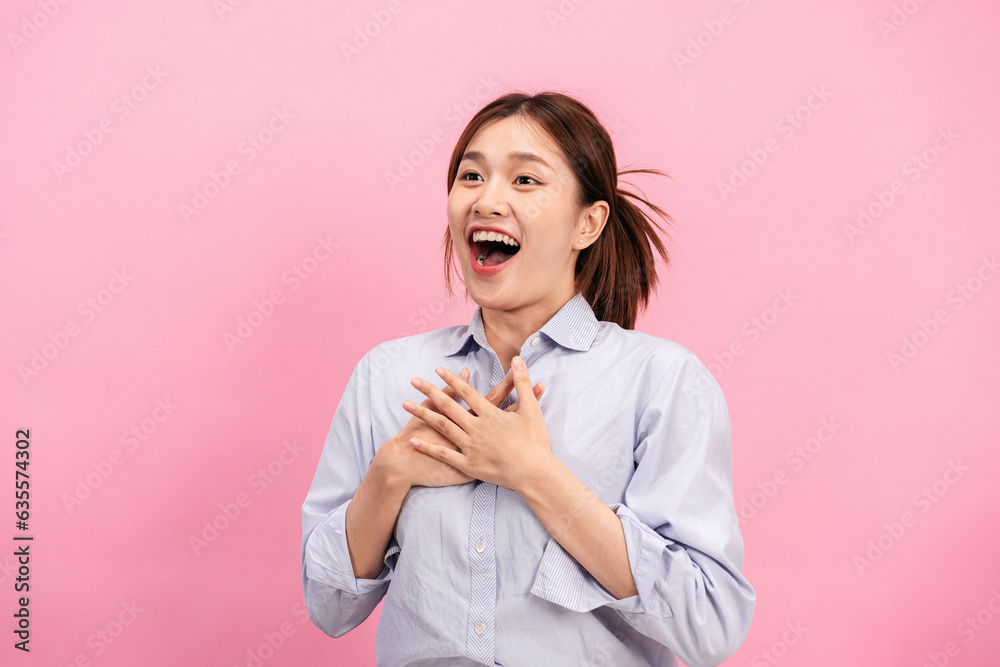 Young asian woman use both hands touching on the chest and open mouth ...