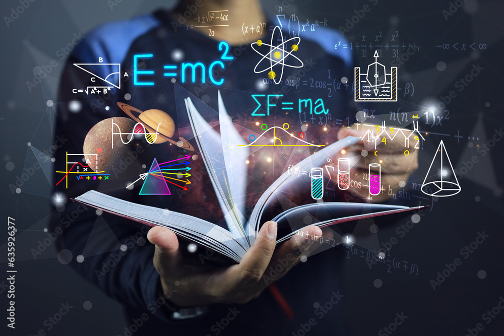 A student or physics scientist open a book to study theory of physics ...