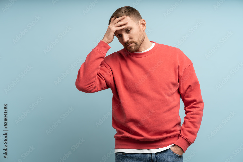 Stock-Foto „Worried man feeling heartbroken and stress put hand to ...
