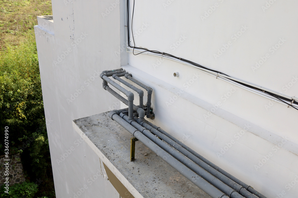 water pipeline. Residential water pipe installation. pvc pipe on wall ...