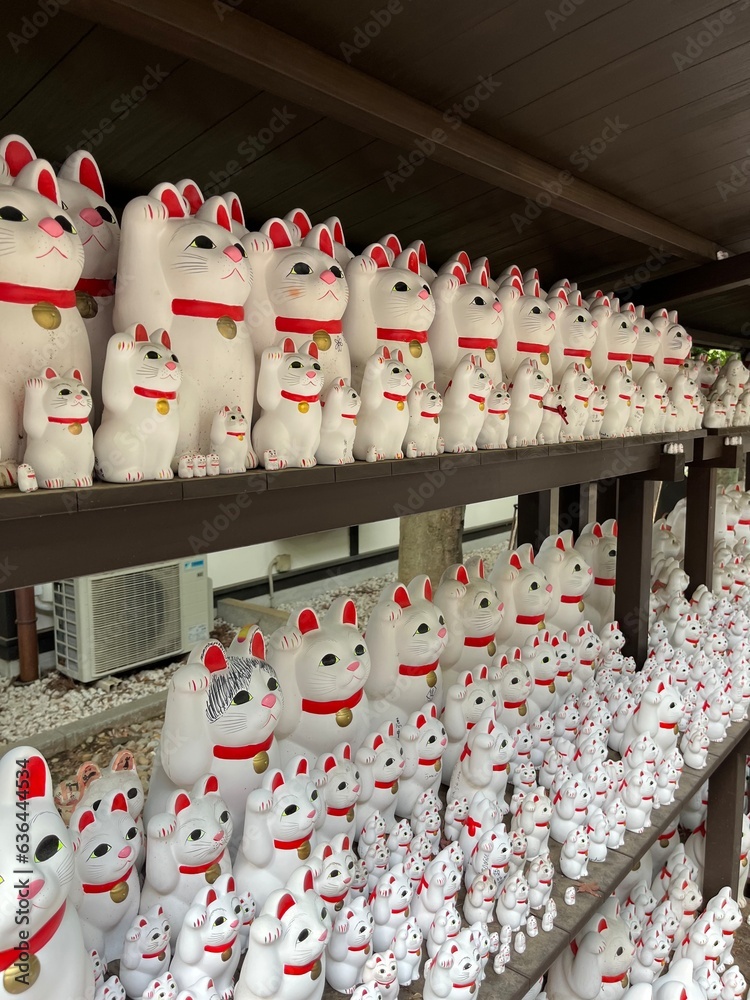 Maneki neko Japanese traditional buddhist lucky cat at Gotokuji Temple ...