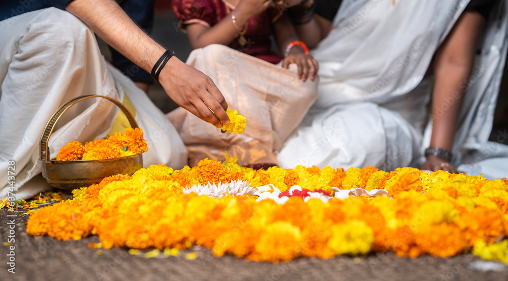 Kerala Onam festival image, Indian family making Onam Pookalam with ...
