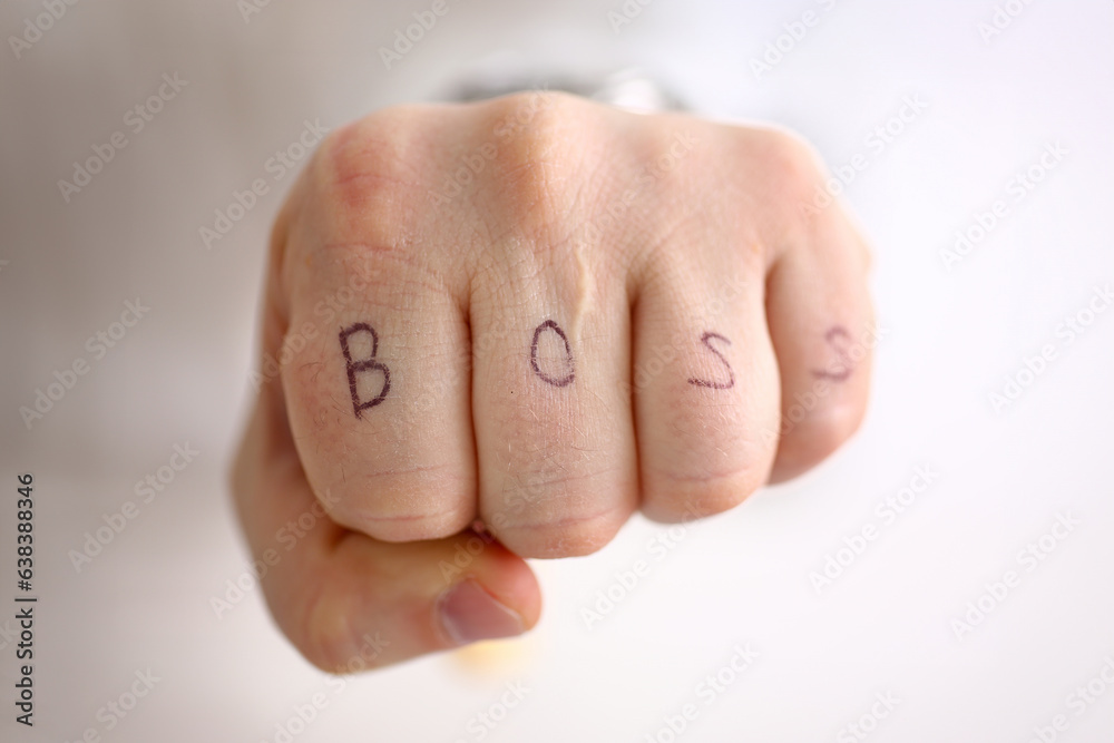 Male clenched fist in suit at office closeup. Aggressive career ...