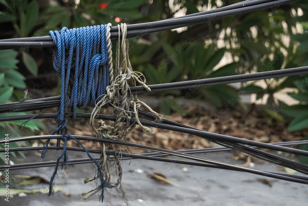 Chaotic tangled power lines and electricity poles are photographed from ...