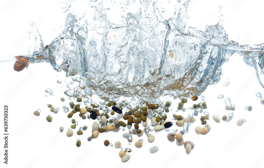 Beans multi grain falls into water and creates air bubbles on surface ...