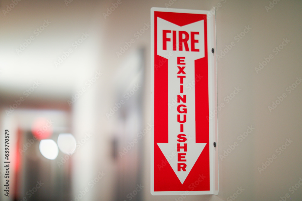 Fire extinguisher and sign depicting safety, urgency, preparedness, red ...
