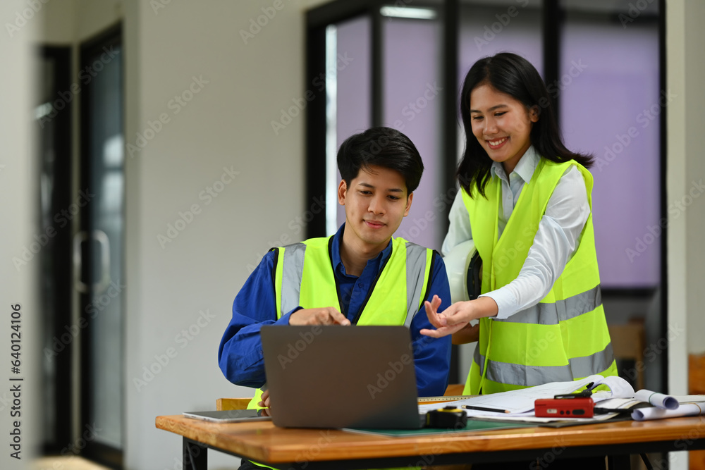 Civil engineer team brainstorming, planning development details at ...