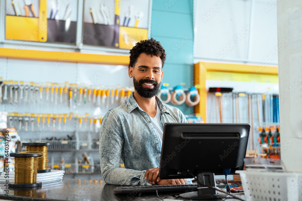 Shop assistant of retail store. Confident Bearded african american man ...