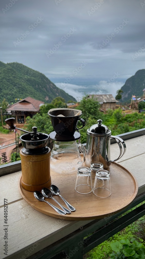 Coffee drip set with valley and misty mountain background at Doi Pha ...