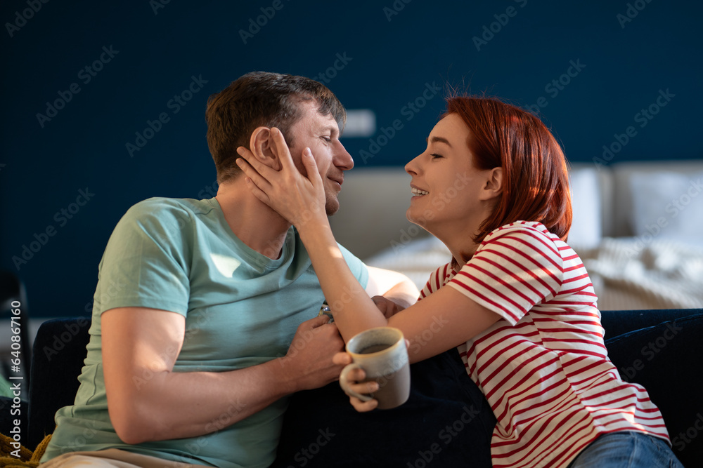 Happy family enjoying each other, adoring woman touching man's cheek ...