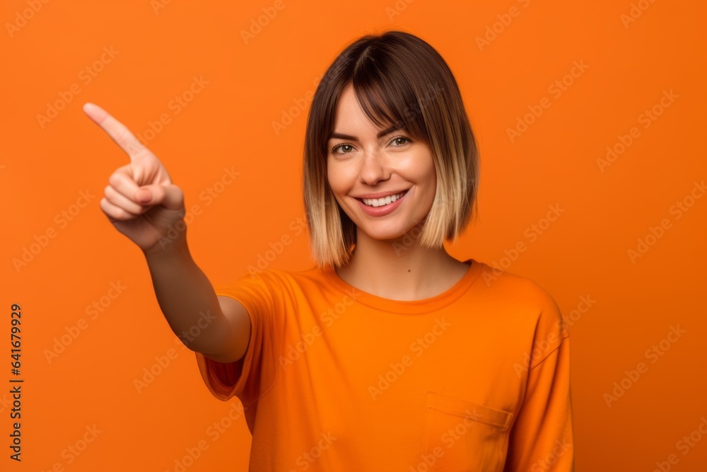 Lifestyle portrait photography of a glad girl in her 30s pointing at ...