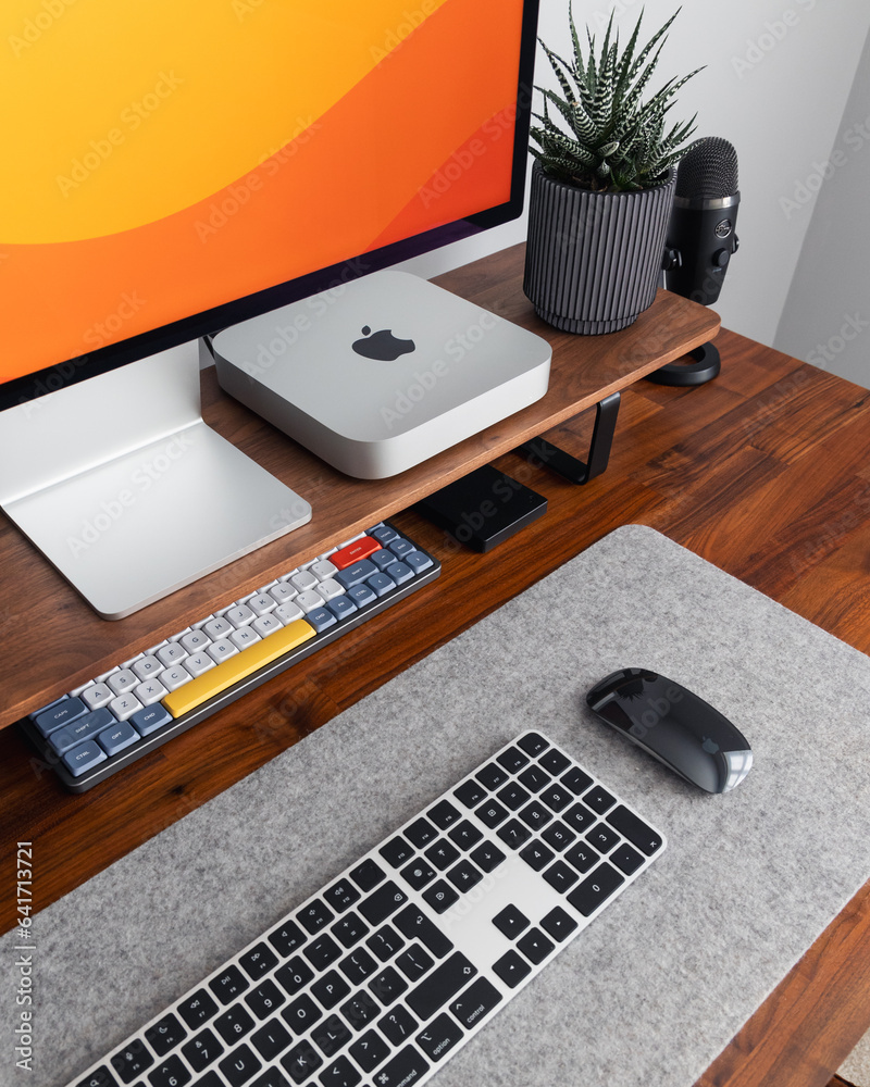 LONDON - AUGUST 24, 2023: Apple Studio Display and Mac Mini computer in ...