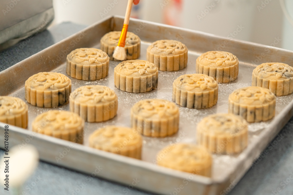 Mooncake making process. A mooncake is a Chinese bakery product ...