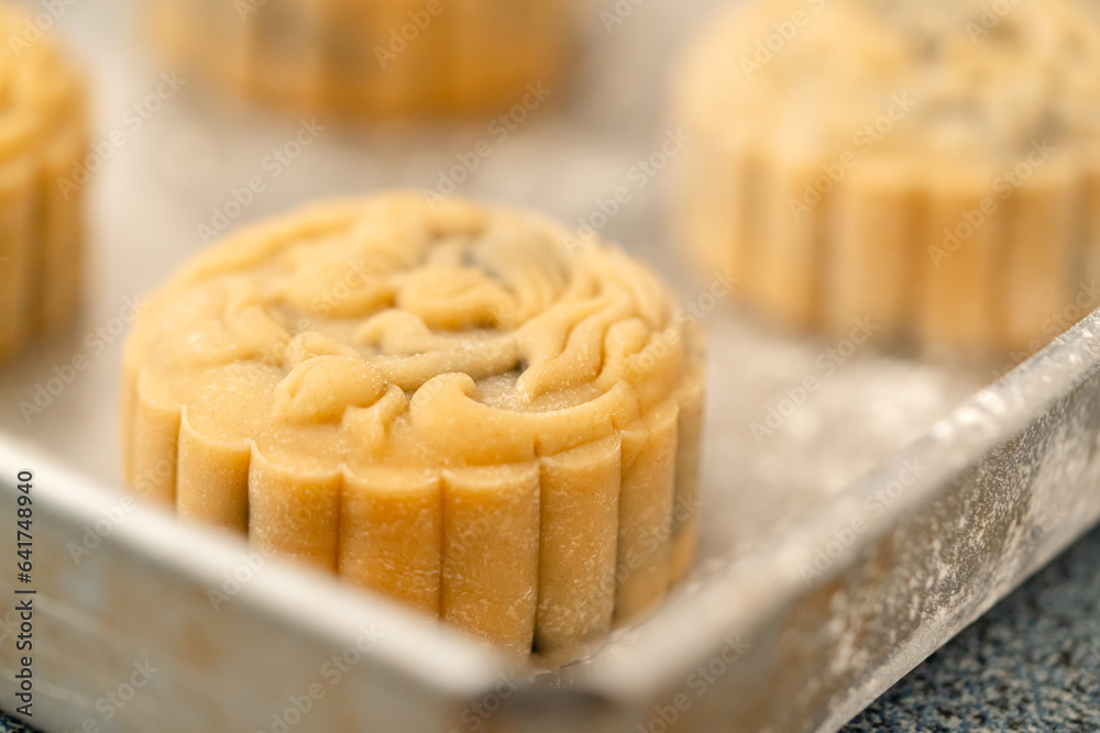 Mooncake making process. A mooncake is a Chinese bakery product ...
