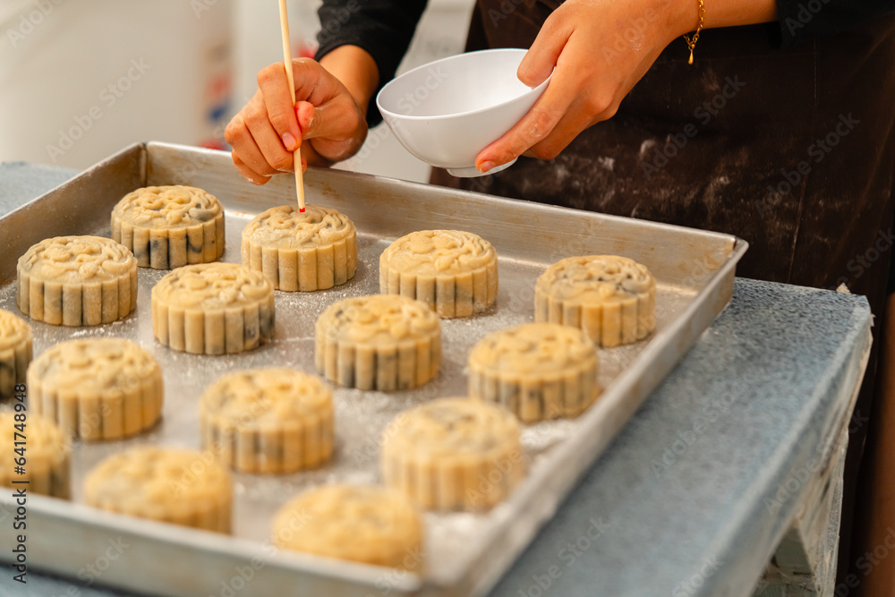 Foto de Stock Mooncake making process. A mooncake is a Chinese bakery ...