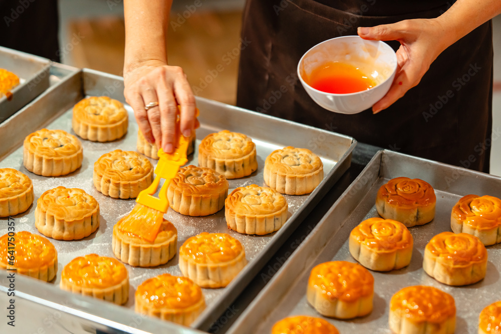 Mooncake making process. A mooncake is a Chinese bakery product ...