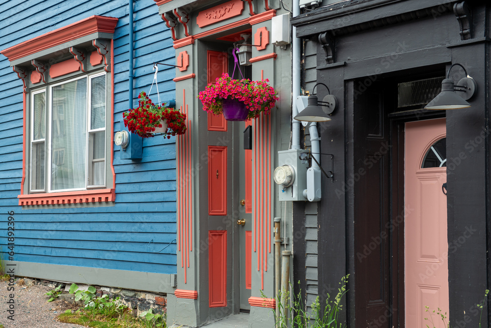 The exterior walls of two wooden adjoined houses. The house is royal ...