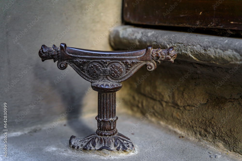 Ornate medieval metail boot scraper on a street in Oltrarno Santo ...