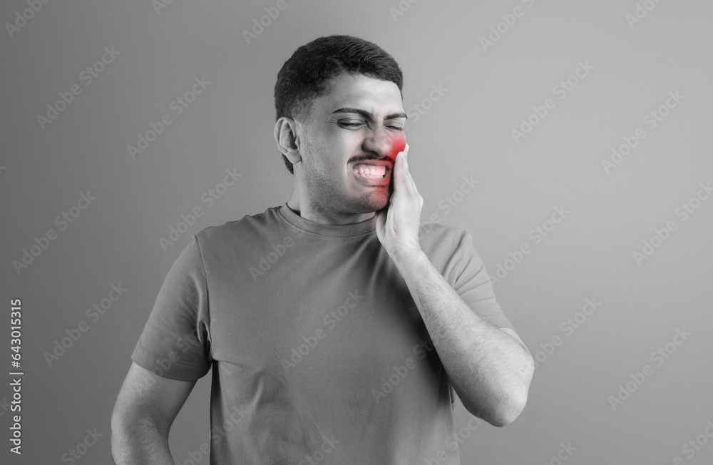 Teeth problem. Young man suffering acute toothache, touching aching red ...