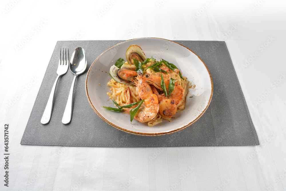 seafood pasta with big tiger prawn, scallop shell clam and muscle in ...