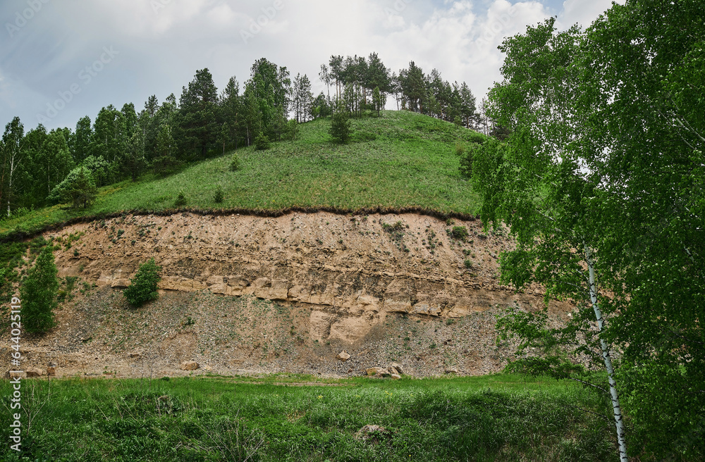 Layers of soil with groundwater. Details of earth layers in a clay pit ...