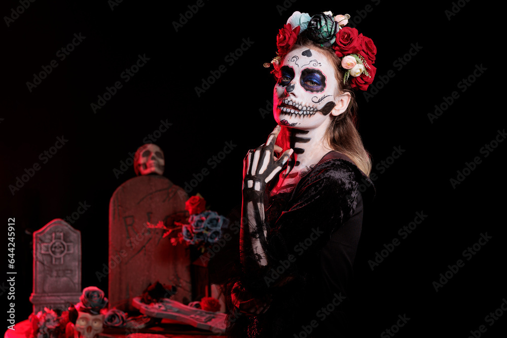 Horror lady of death wearing black glamorous costume in studio, looking ...