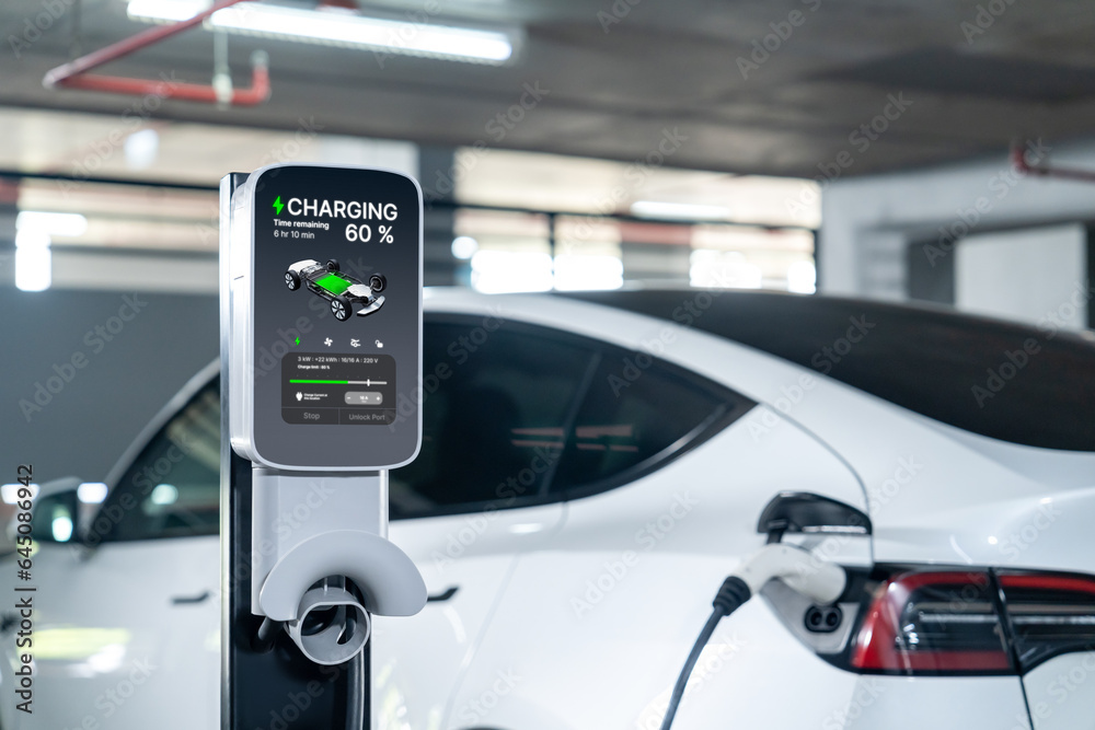 EV electric car recharge at shopping center parking lot charging in ...