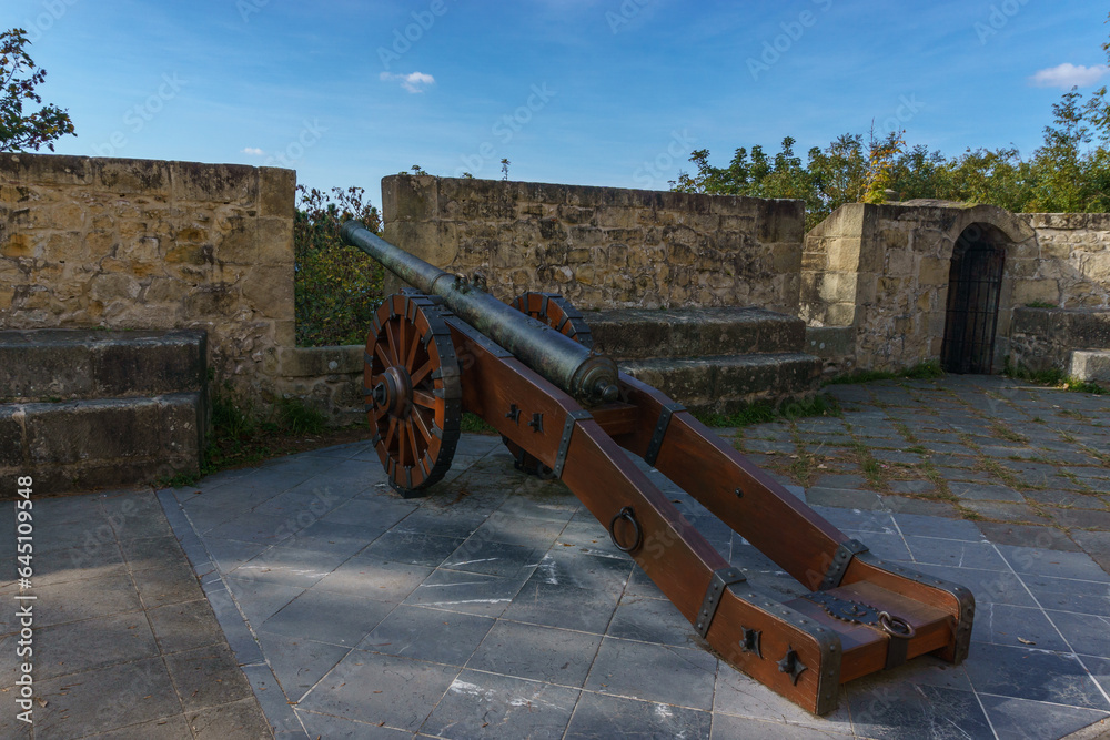 Antique cannon artillery defensive weapon at historic fort building ...