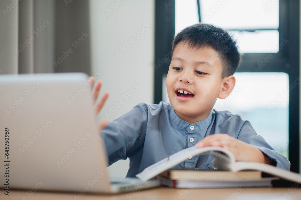 Little Asian boy student using computer laptop learning. Educational ...
