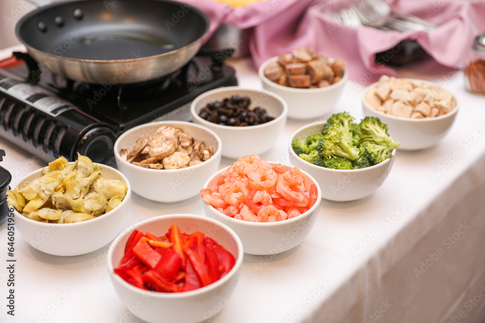 Potluck party with a delightful spread of meat, vegetables, and bread ...