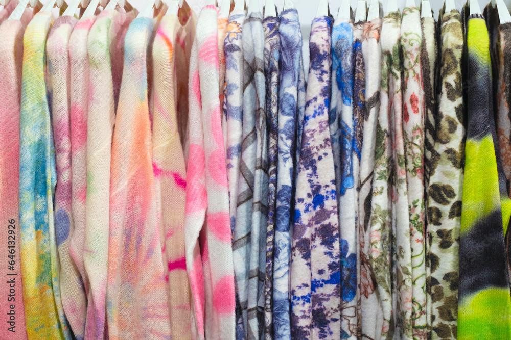 Fashion clothes on clothing rack Closeup of rainbow color choice female ...