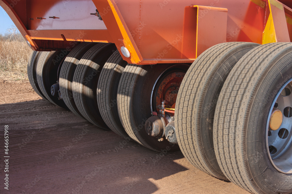 multi tire wheels on the axle of a heavy trailer what is hauling mining ...