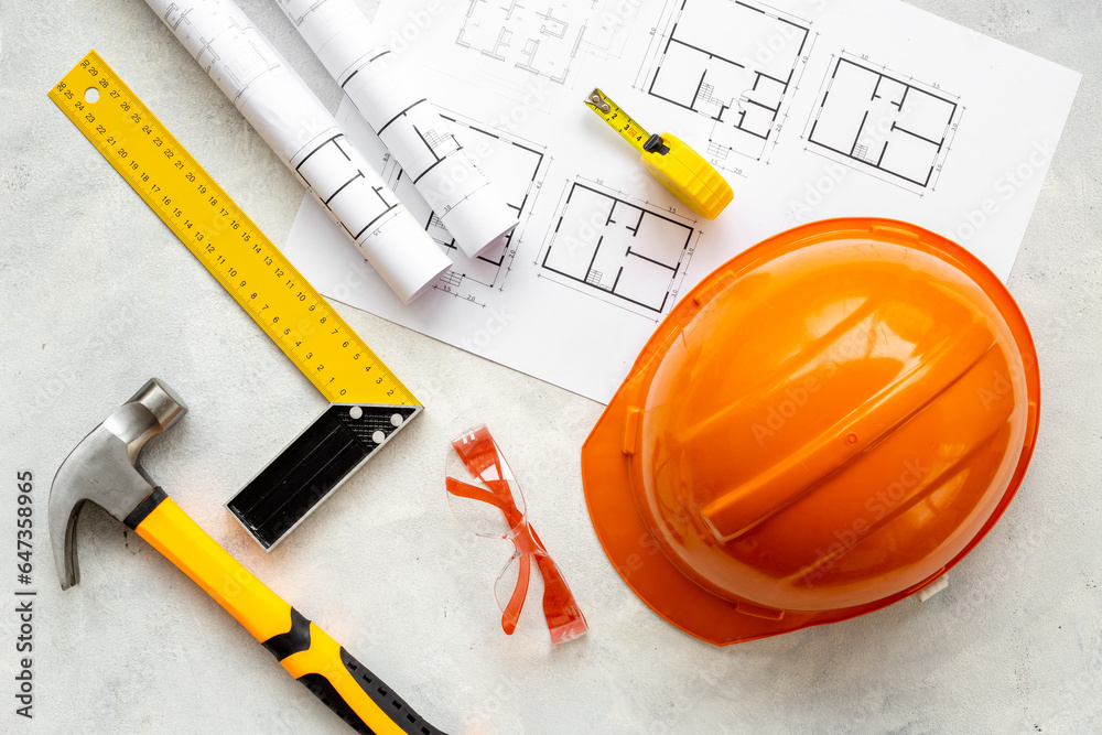 House design drawing blueprints with hard hat. Construction engineering ...